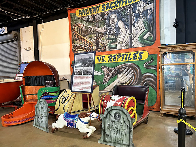 Ancient sacrifices vs. reptiles? This carnival banner proves that showmanship has no bounds &ndash; or taste limits.