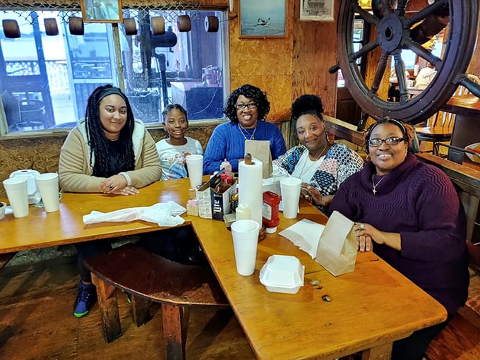 Happy faces and full plates - the universal language of a great meal. These diners are clearly fluent in seafood satisfaction.