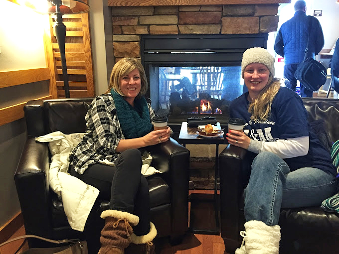 Cozy corner alert! Nothing beats catching up with a friend over coffee by a roaring fire. It's like a Hallmark movie come to life!