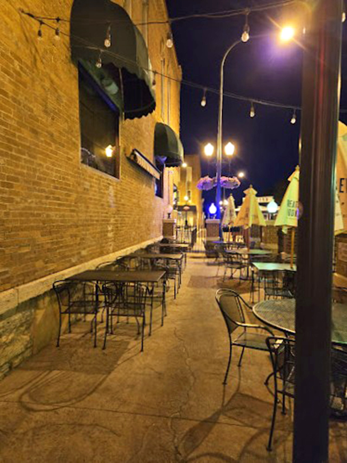 Outdoor seating that whispers, "Stay awhile." String lights add a touch of magic to your al fresco feast.