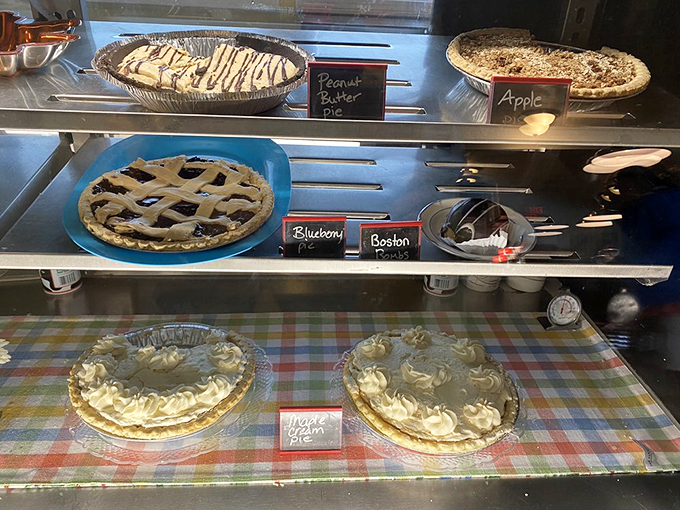 Sweet temptation alert! This dessert case is like a museum of deliciousness. Go ahead, treat yourself – we won't tell your dentist.