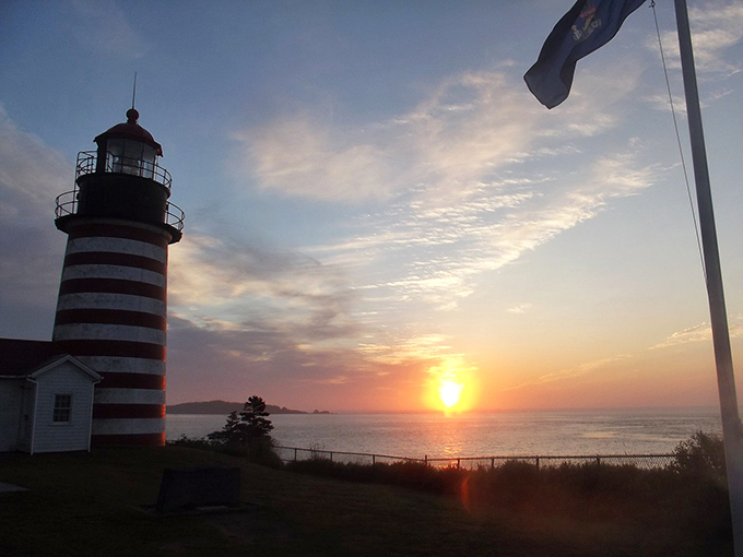 Sunset spectacular! As day bids adieu, the lighthouse takes center stage in nature's most dazzling light show.
