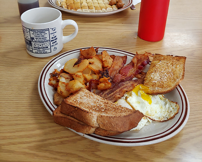 The breakfast trifecta: crispy, savory, and sunny-side up. This plate is proof that sometimes, the simplest things in life are the most satisfying.