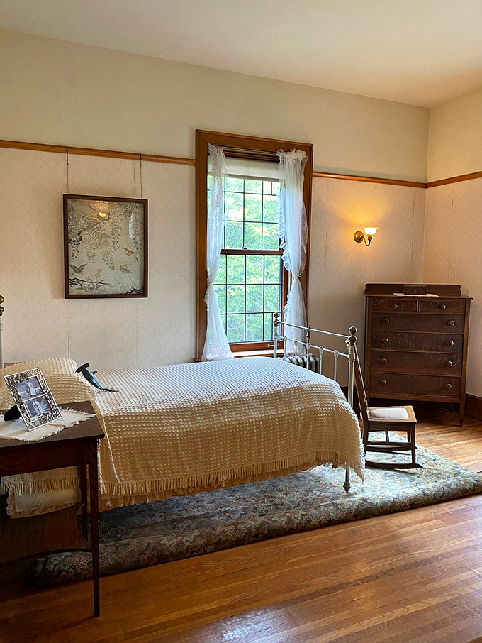 Simplicity meets elegance in this bedroom. It's like a cozy cocoon wrapped in early 20th-century charm.