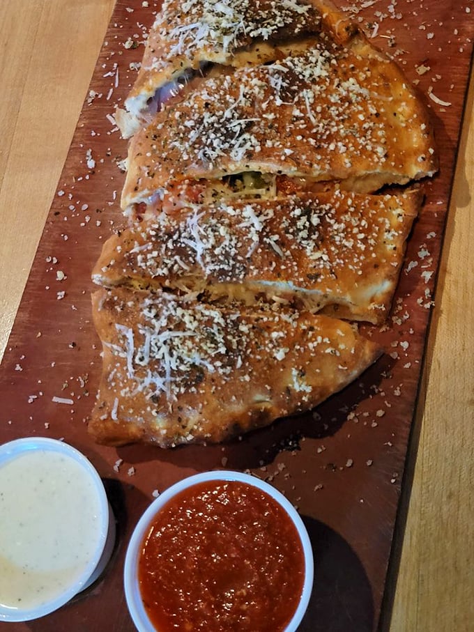 Meet the calzone: pizza's mysterious, folded-up cousin. This golden pocket of joy is like a warm, edible hug filled with cheesy secrets and sprinkled with Parmesan promises.