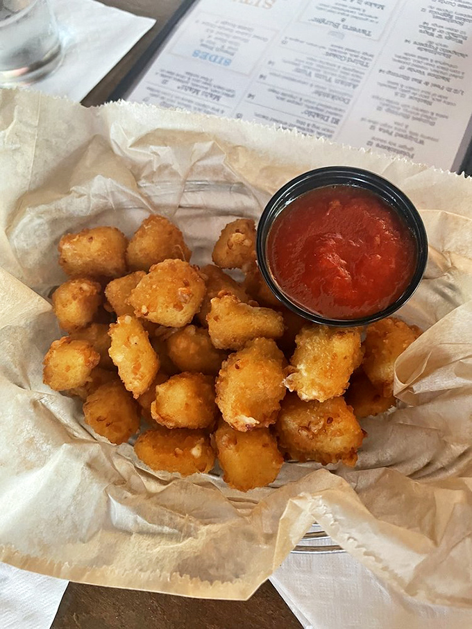 Golden nuggets of joy! These cheese curds are so good, they might just convince you to trade your Tigers cap for a Packers one.