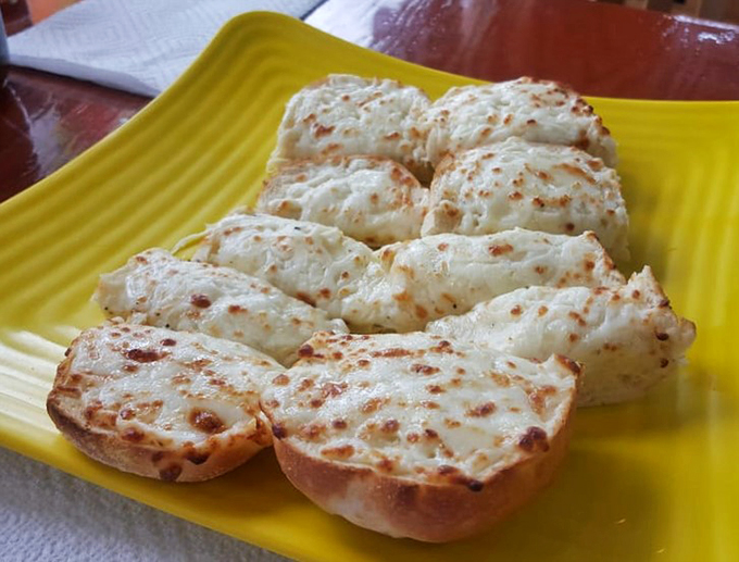 Cheese pulls for days! This gooey, garlic-kissed bread is what happens when carbs and dairy have a beautiful, beautiful baby.