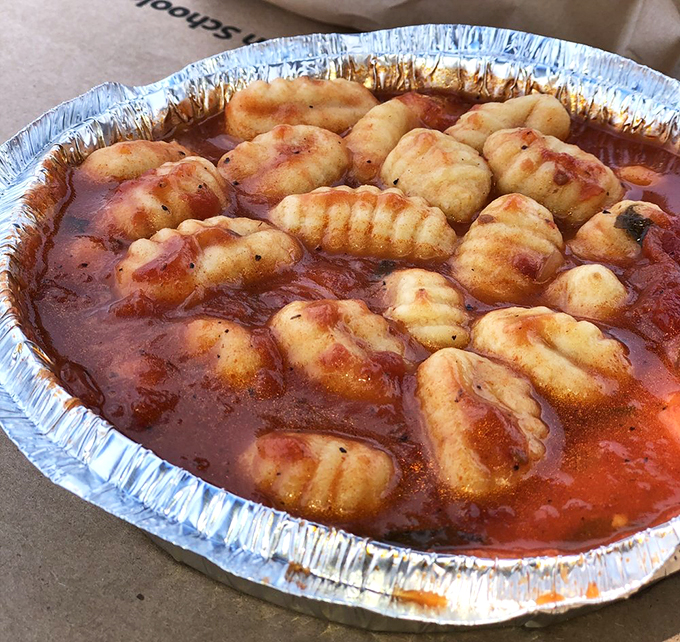 Gnocchi heaven! These pillowy potato dumplings swimming in savory sauce are like little clouds of flavor. Who needs a silver lining when you've got gnocchi?