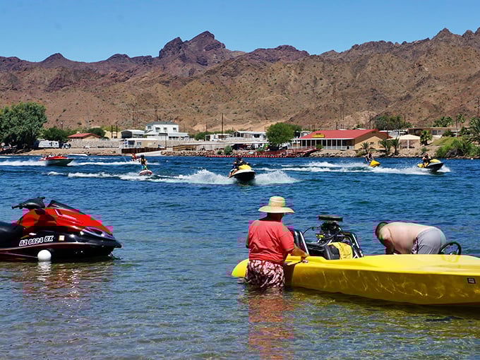 Watersports wonderland: Jet skis carve liquid trails while kayakers paddle by. It's like a real-life video game, but with better graphics and no cheat codes.