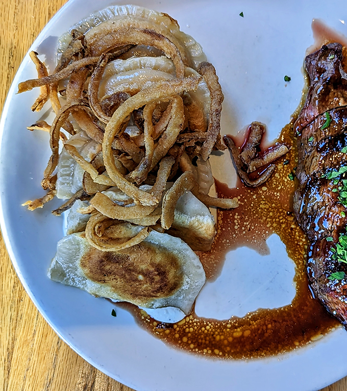 Pierogies and crispy onions: a dynamic duo that puts Batman and Robin to shame. It's Eastern European comfort food with a crispy twist.