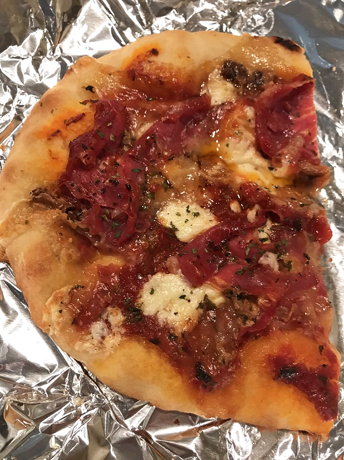 Pizza perfection! This slice looks so good, it might just make you forget about your New Year's resolutions.