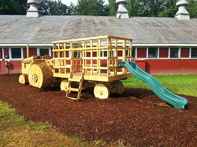 All aboard the fun express! This playground hay wagon is proof that farm kids have way cooler rides than city slickers.