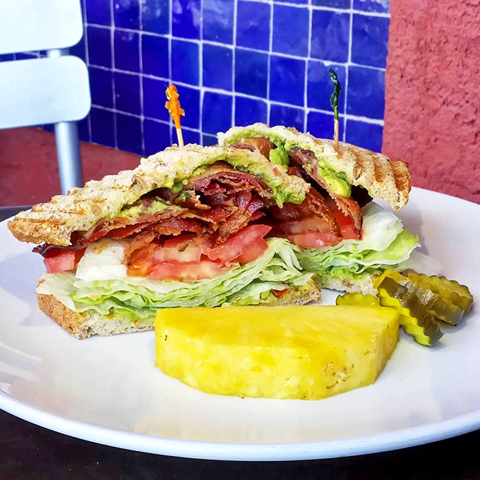 Behold, the sandwich of your dreams! Stacked higher than a Jenga tower, it's a balancing act of flavors that'll have you saying, "Take that, Earl of Sandwich!"