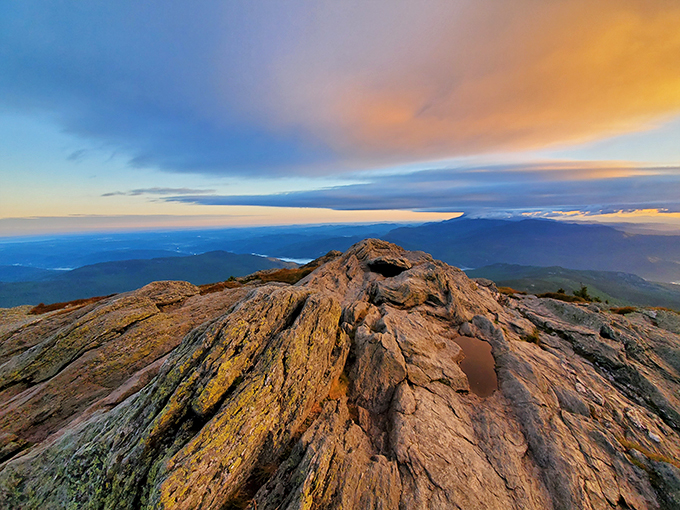 Sunset symphony: Camel's Hump at golden hour - where the rocks glow like hot coals and the sky puts on a light show that would make Broadway jealous.
