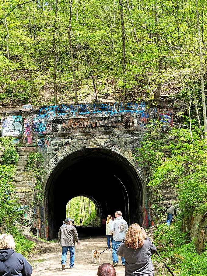 Tunnel vision: Daylight reveals Moonville's less spooky side, as curious visitors explore this relic of the railroad age.