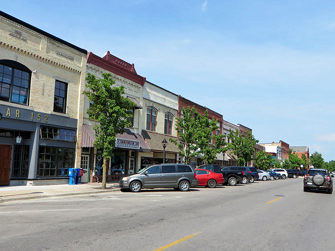Elk Rapids' River Street: A shopper's paradise where your wallet might get lighter, but your heart definitely gets fuller.