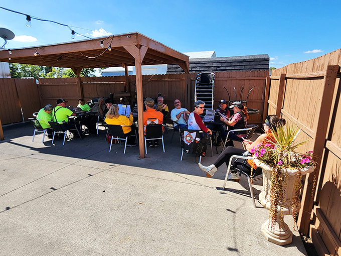Community table! These outdoor diners prove that at Woody's, strangers are just friends who haven't shared a meal yet.
