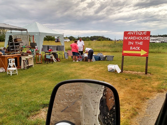 The outdoor overflow: where antiques go for fresh air. It's a yard sale that time forgot, complete with mysterious boxes and potential treasures.