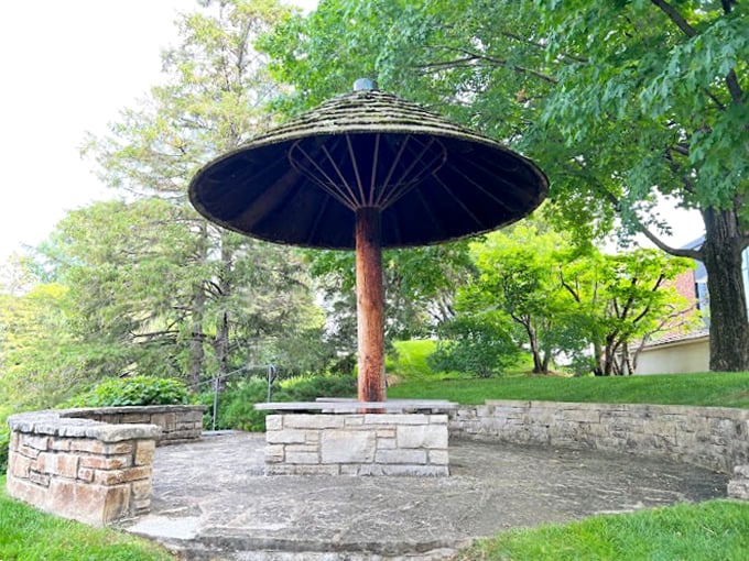 The world's most stylish mushroom or a cozy spot for garden gnomes? This whimsical shelter invites visitors to pause and ponder.