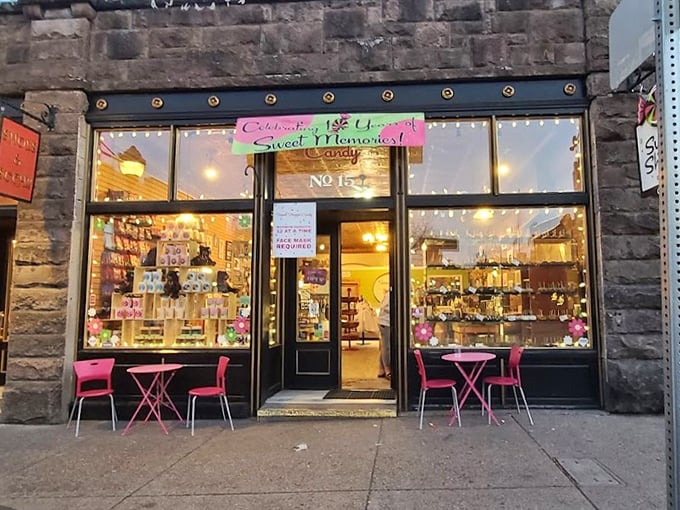 As the sun sets, the sweet shop glows! This inviting storefront is like a lighthouse, guiding sugar-seekers safely to shore.