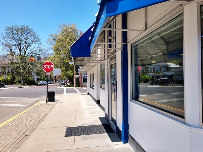 The sidewalk outside Carl's: where food comas begin and diets come to die. But trust me, it's worth every delicious step!