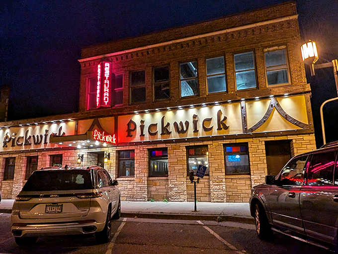 As night falls, the Pickwick glows like a beacon of culinary delight. It's dinner time, and adventure awaits!