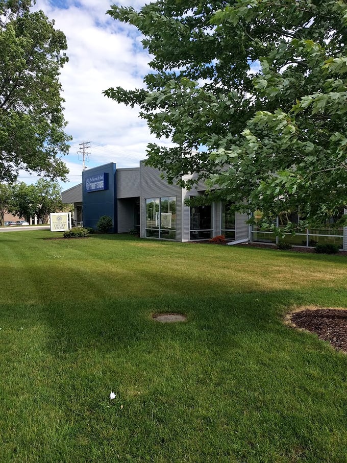 A thrift store oasis in a sea of grass! This exterior view promises a cool respite from the summer heat and hot deals inside.
