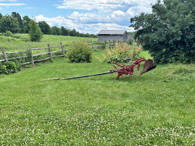 Field of dreams: This antique plow resting in a sun-dappled meadow is giving major "Charlotte's Web" vibes, minus the talking animals.