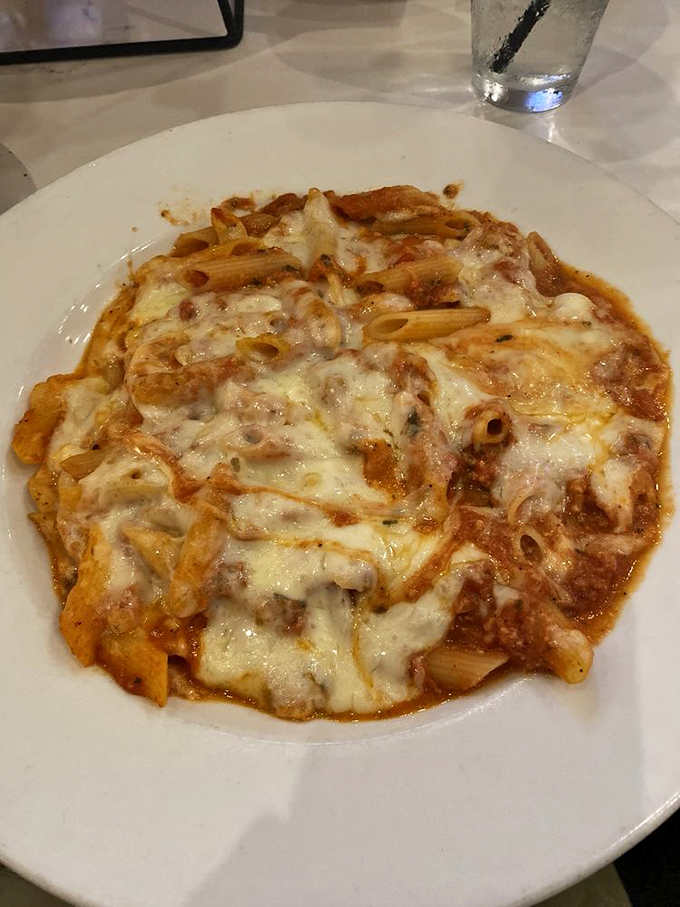 Baked ziti: where comfort food meets culinary art. It's like a warm hug for your taste buds, with cheese pulling longer than a telenovela plot.