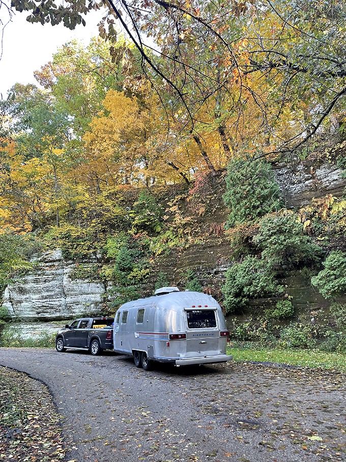 "Glamping goals! This Airstream setup proves you can rough it in style, like a silver bullet of comfort in the wilderness."