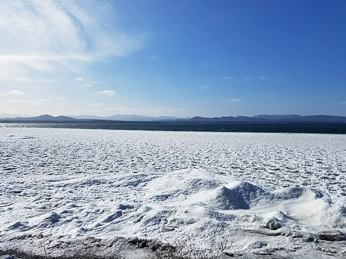 Charlotte Town Beach in winter: where Lake Champlain transforms into a stunning ice sculpture. Elsa would be jealous.
