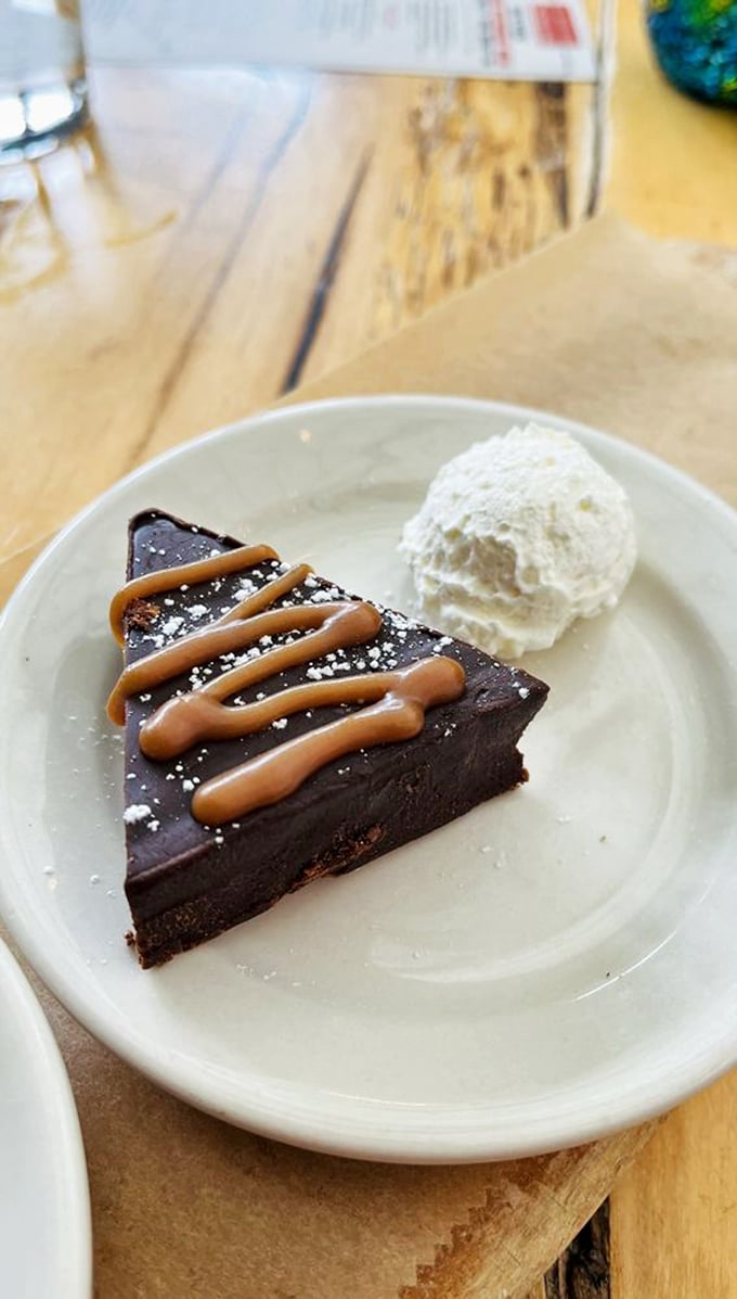 A chocolate truffle cake so decadent, it should come with a warning label. Resistance is futile, just give in to the cocoa bliss!