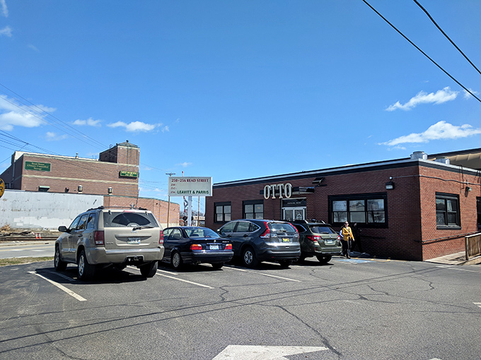 OTTO's parking lot: The starting line for your pizza pilgrimage. Rev up your appetite, folks - cheesy nirvana awaits just steps away!