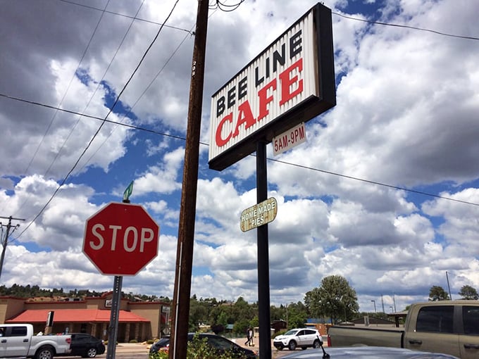 Your beacon to breakfast bliss! This classic diner sign stands tall against the Arizona sky, promising good eats and even better company inside.