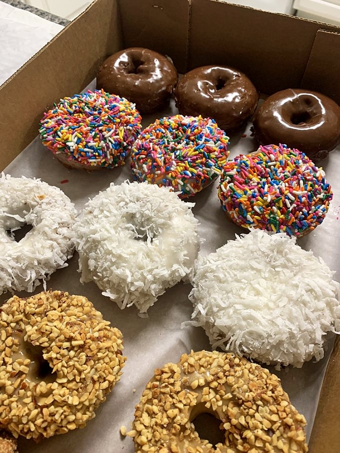 A box of joy, sprinkled with happiness. These donuts are like edible works of art, each one a masterpiece of flavor.
