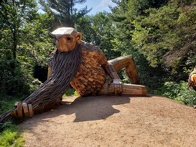 Troll-y not your average park attraction! Benny lounges in full view, ready to charm visitors from every angle.