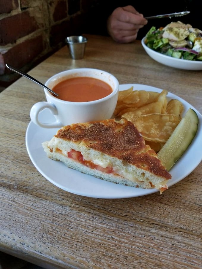 The ultimate comfort food trifecta: grilled cheese, tomato soup, and a pickle. It's like a warm hug for your taste buds!