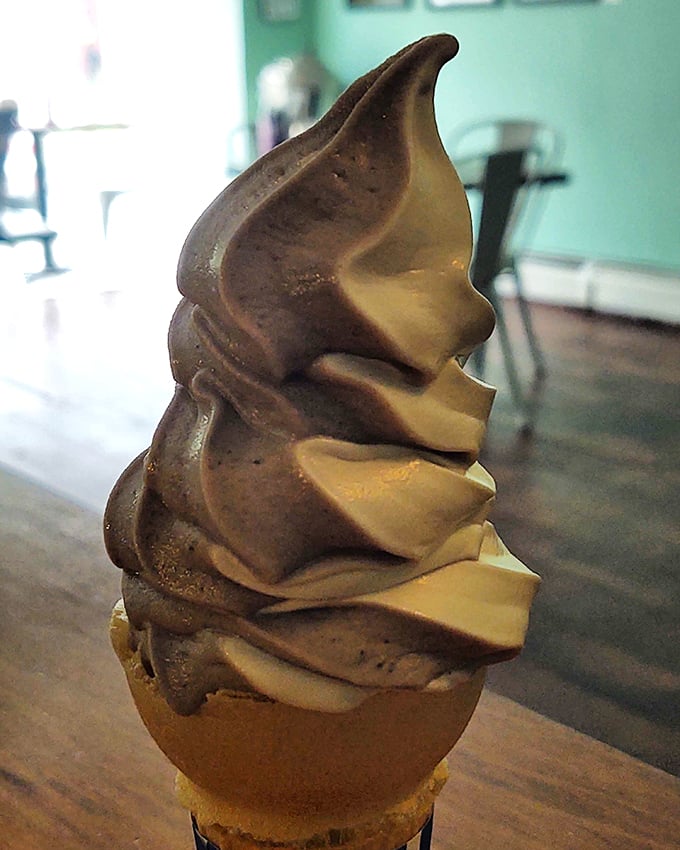 The Leaning Tower of Ice Cream! This swirl is defying gravity and tempting taste buds in equal measure. Lick it before it melts or topples!
