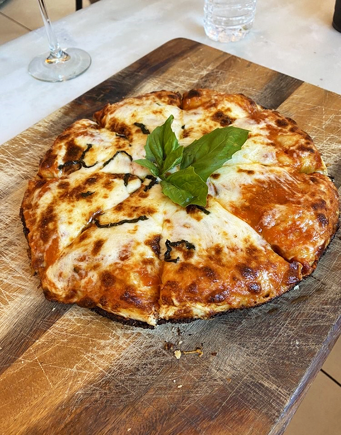 Pizza that's amore at first bite. This cheesy, bubbly masterpiece is proof that sometimes, the simplest things in life are the most delicious.