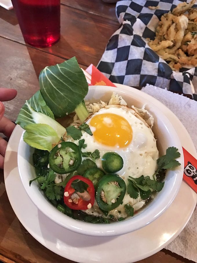Ramen with a twist! This steaming bowl of goodness is like a warm hug for your insides, topped with a sunny-side-up egg that's all smiles.