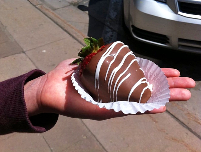Chocolate-covered temptation on a stick! This strawberry's formal wear is fancier than most prom dresses.