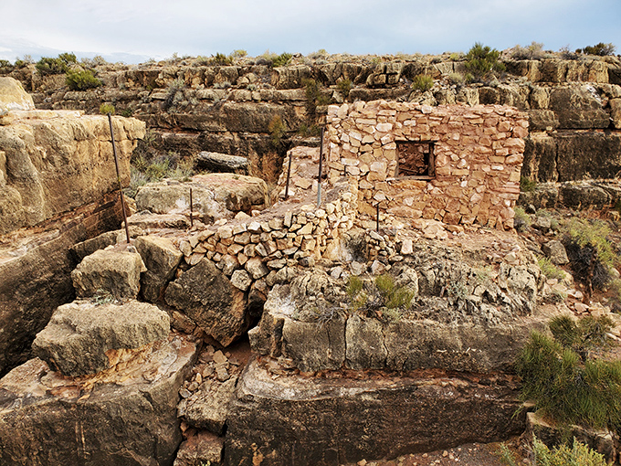 Perched on the canyon's edge, these stone sentinels have watched over the desert for nearly a century.