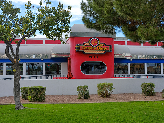 Red alert! This diner's exterior is brighter than my future. A retro beacon in the desert.