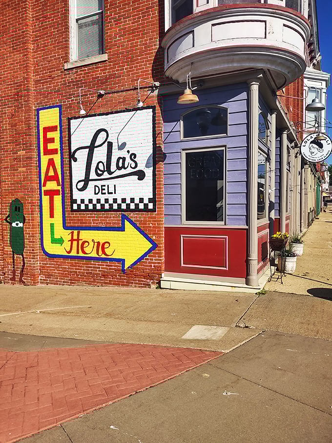 "Eat Here" indeed! Lola's colorful facade is like a beacon for sandwich lovers, promising laughter and love with every bite.