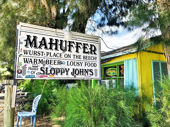 Wurst place on the beach? More like the best! Mahuffer's sign promises warm beer and lousy food &ndash; a siren call for dive bar aficionados.
