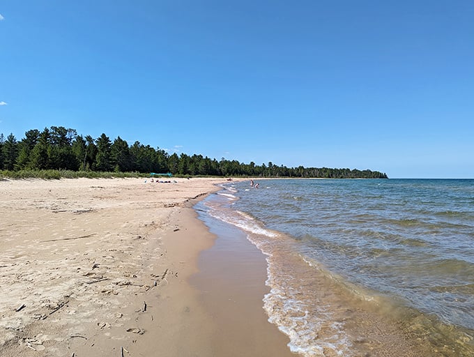 Negwegon State Park: Nature's own infinity pool! Lake Huron's crystal-clear waters meet pristine sandy shores, creating a beach lover's paradise.