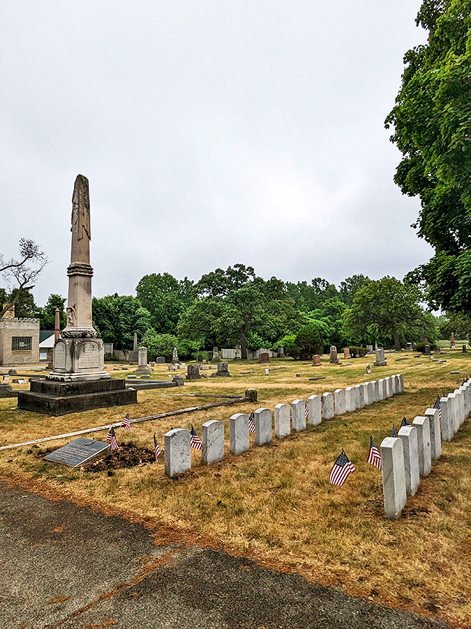Rosehill Cemetery: Where history stands tall and proud. This towering monument commands attention, surrounded by a sea of memories and American flags.