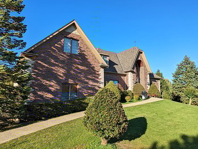 A Tuscan dream in the Midwest! This brick beauty beckons wine lovers with its manicured lawns and promise of vineyard views.