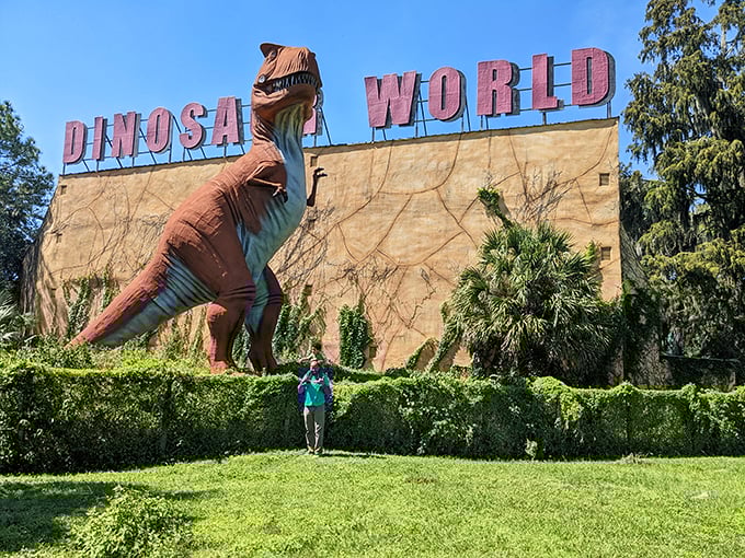 Who needs time travel? This Brachiosaurus looks ready to munch on the 'Dinosaur World' sign for a leafy snack.