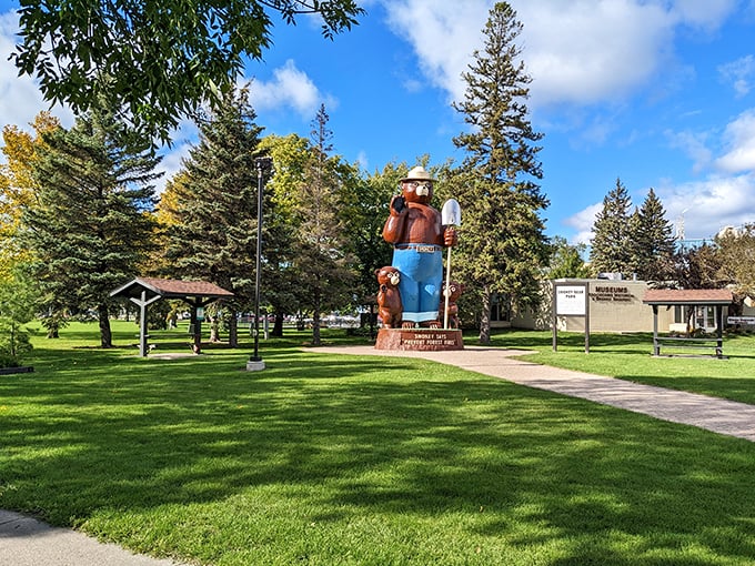 A bear-y big surprise awaits! This gentle giant stands guard over a lush green oasis.